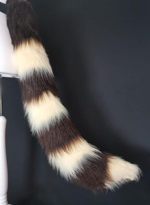 Animatronic raccoon tails that wag and tremble, stand up and get frisky